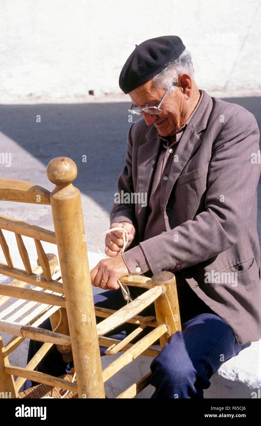 Senior man braiding chair seat in Almeria, Spain Stock Photo - Alamy