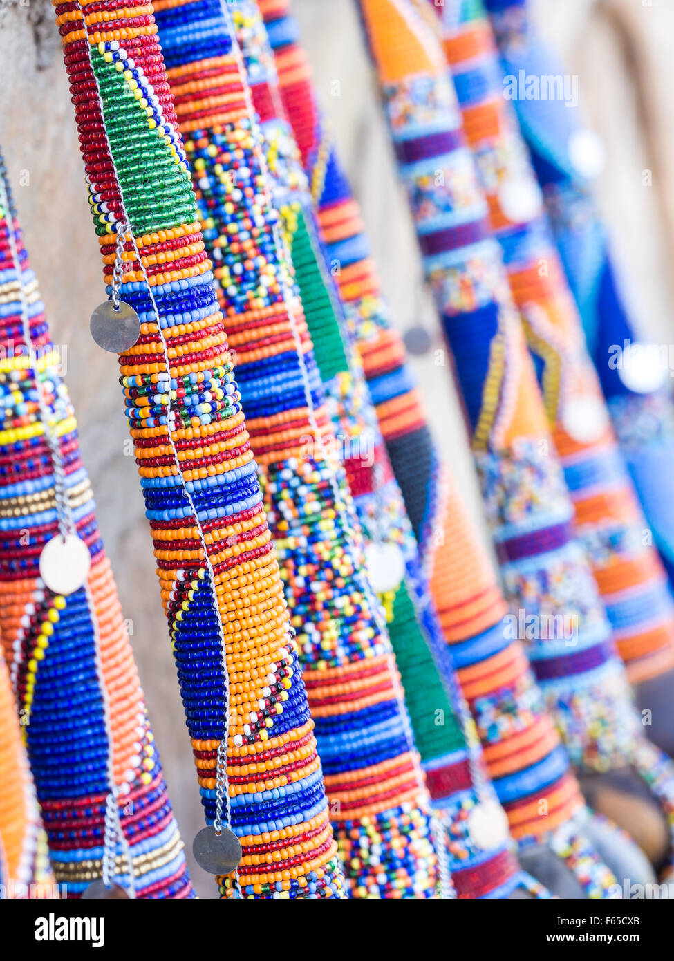 Maasai rungu (club) decorated with beads and sold as a souvenir at a ...