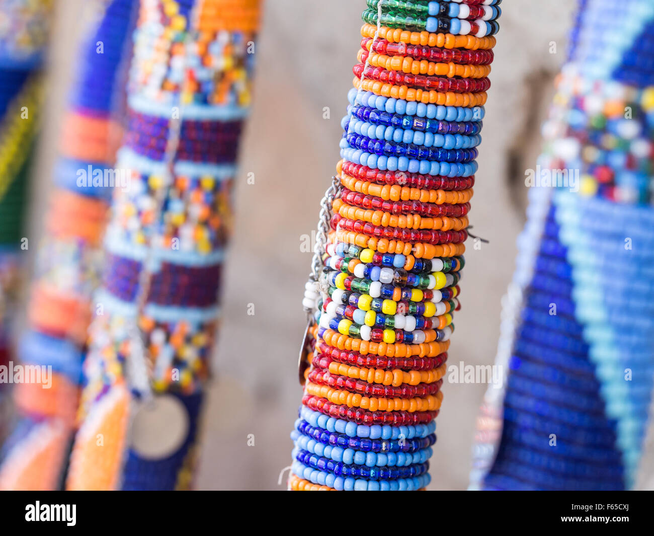 Maasai rungu (club) decorated with beads and sold as a souvenir at a ...
