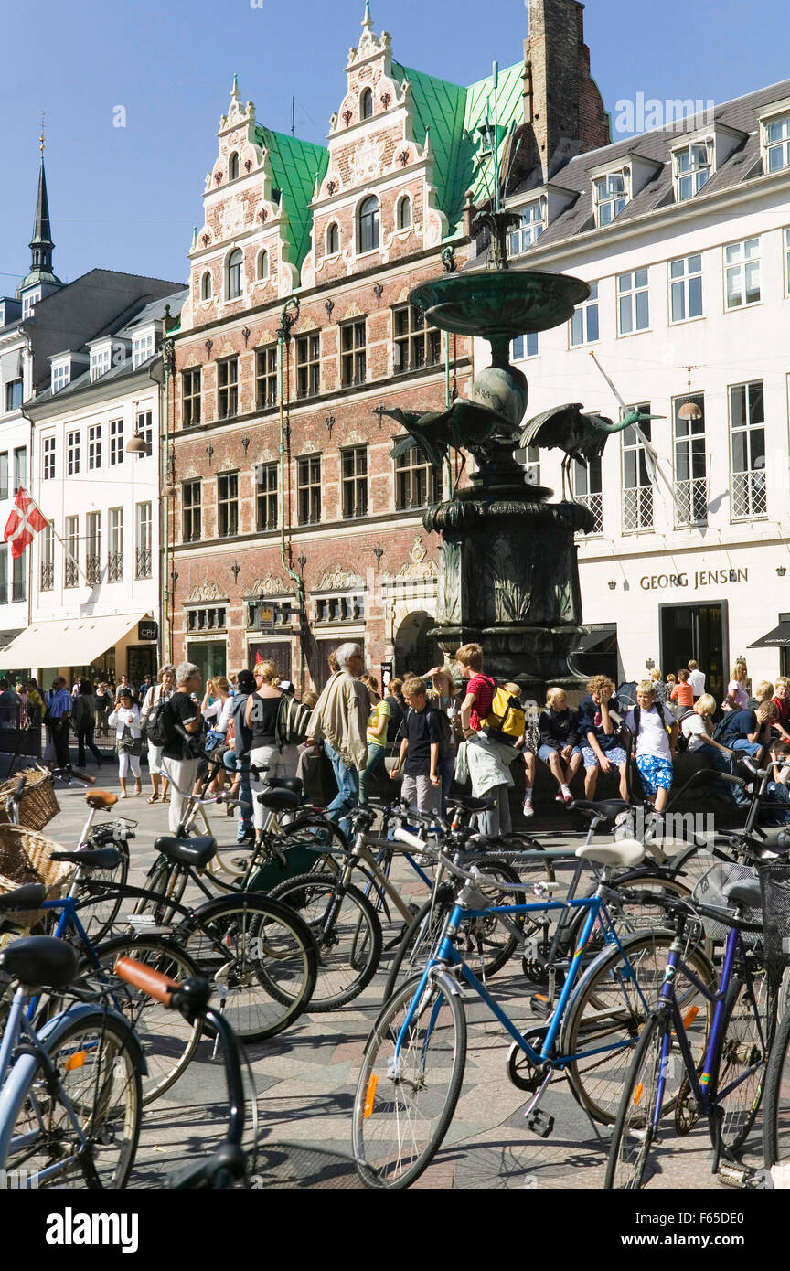 Parked bicycles and fountain at Amager Square in Copenhagen, Denmark ...
