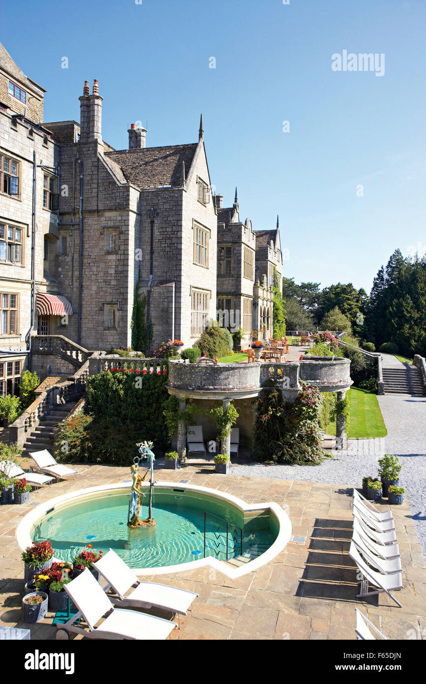 View of hotel Bovey Castle with garden and loungers in front, Devon, UK ...