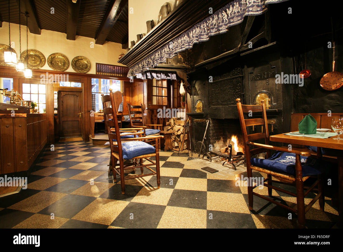 Old interiors and fireplace in restaurant Stock Photo - Alamy