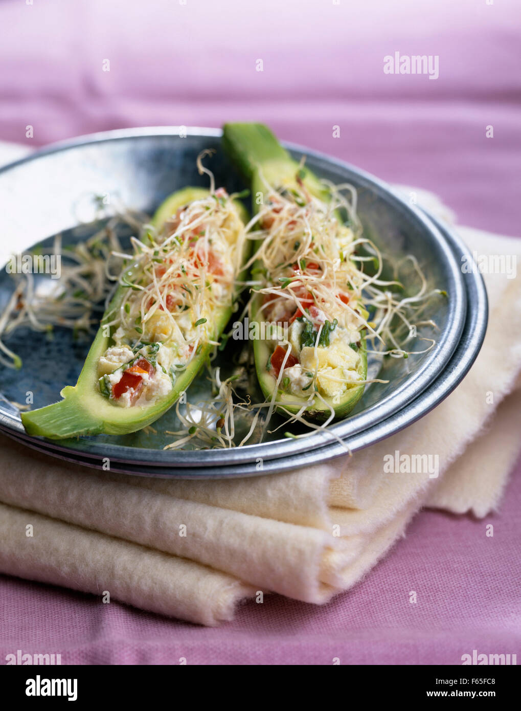Courgette stuffed wth sprouted millet and spring onions Stock Photo - Alamy