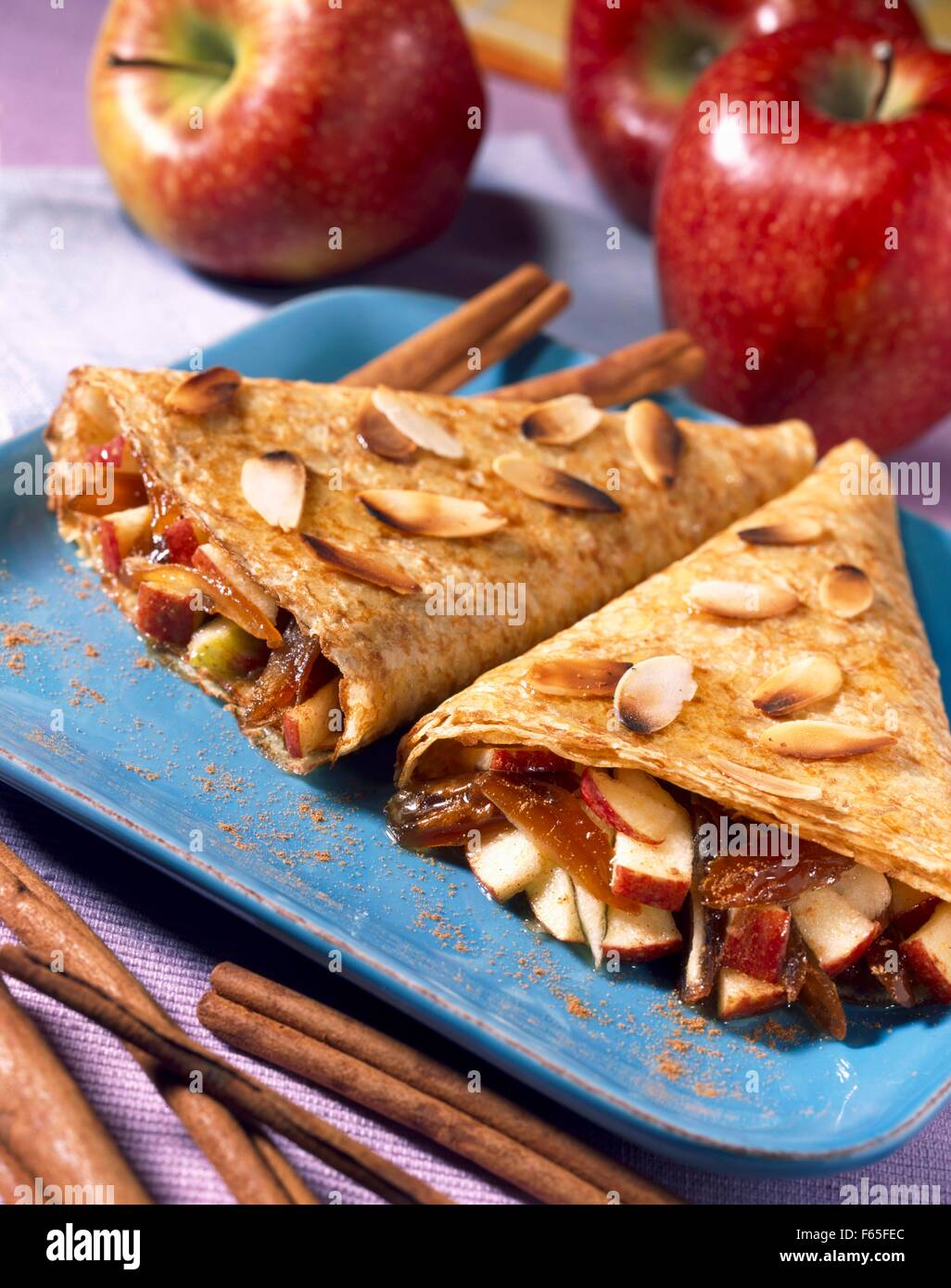 Pancake cones filled with dates and apples Stock Photo - Alamy