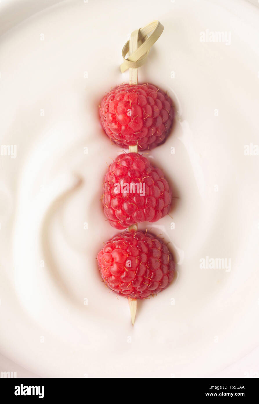 raspberry skewer in cream Stock Photo - Alamy