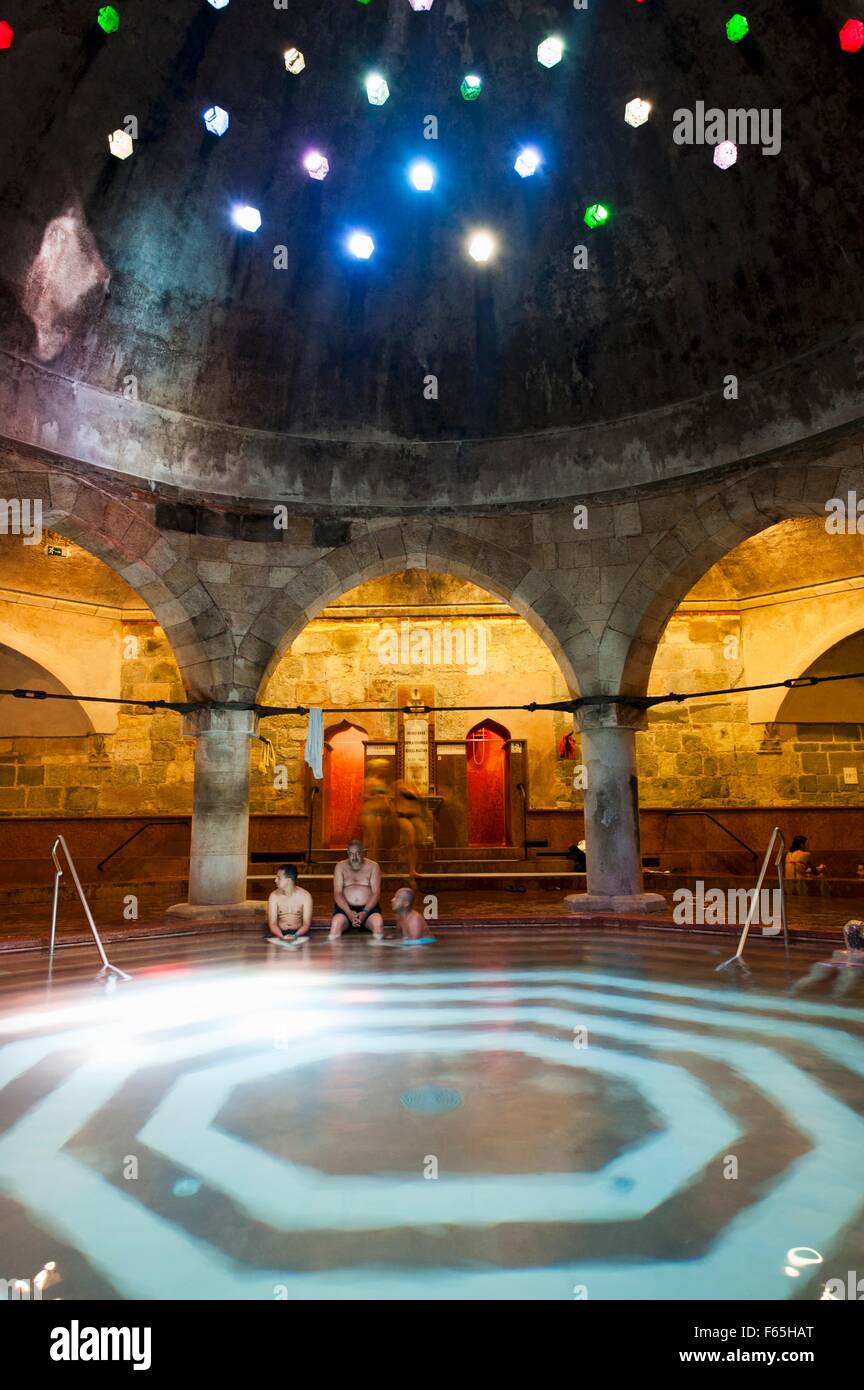 Sunlight slanting through the coloured glass of the octagonal pool in ...