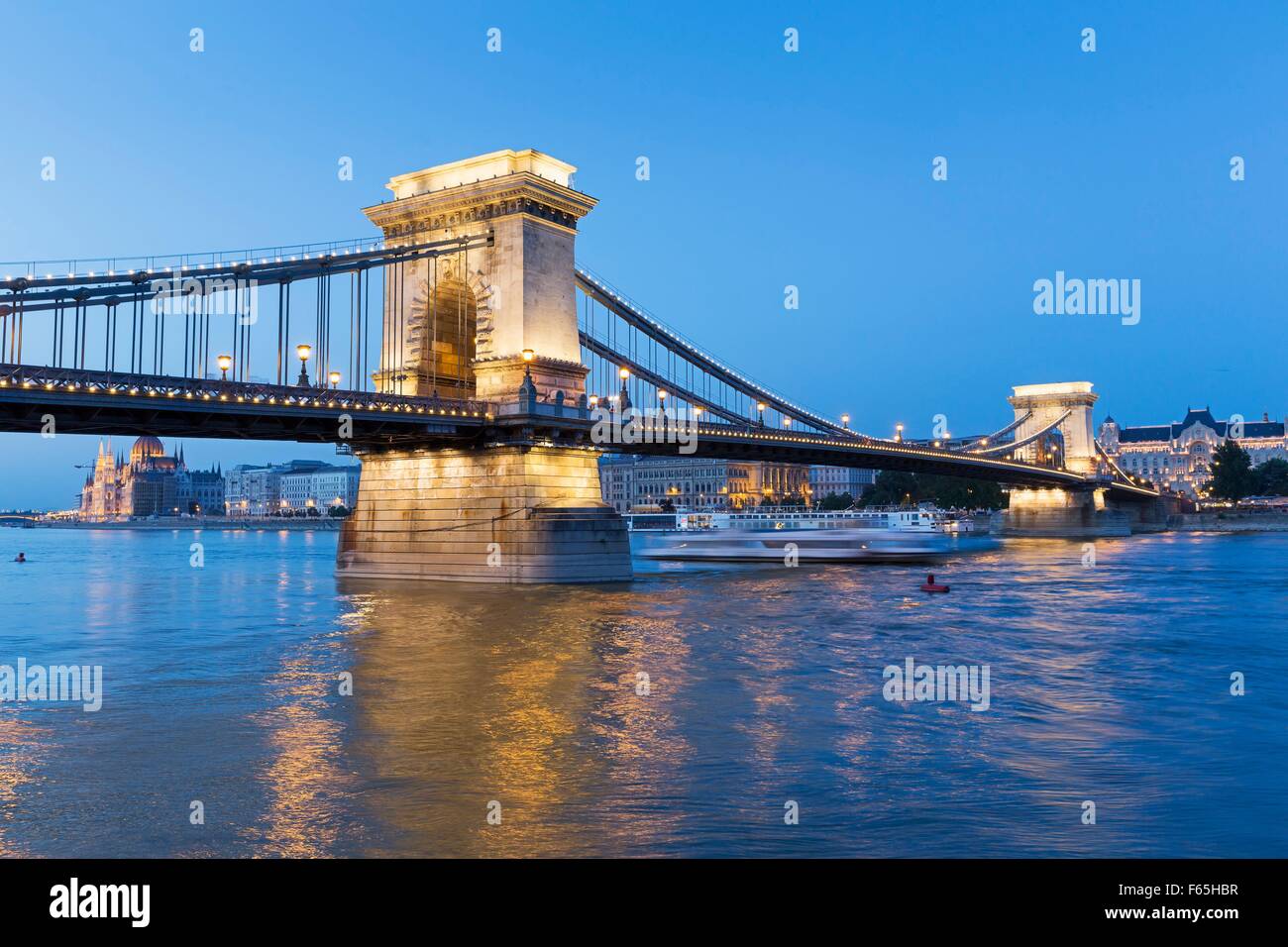 A view from the Pest Bank of the 380 metre long Chain Bridge at dusk ...
