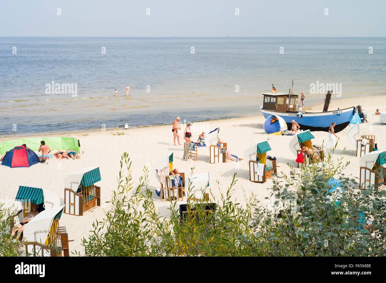 A fishing boat and beach chairs on the beach at Heringsdorf on the ...