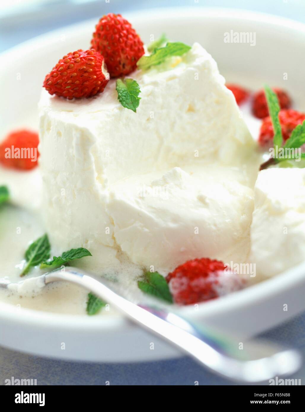 Faisselle cheese with wild strawberries and mint Stock Photo - Alamy