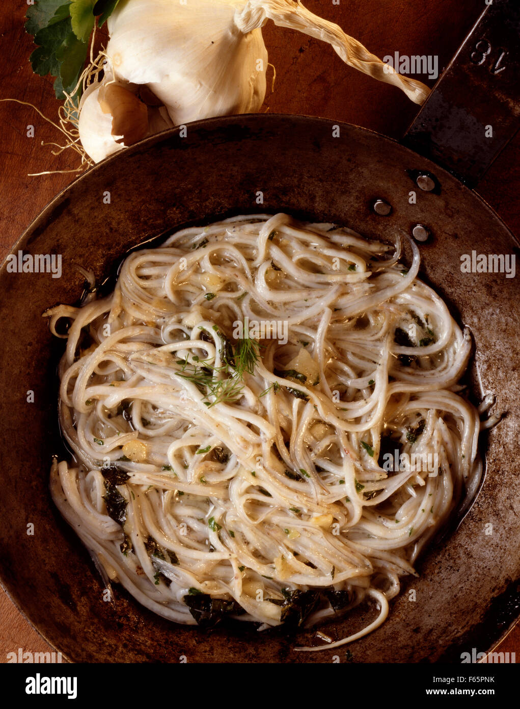 Elvers cooked with garlic Stock Photo - Alamy