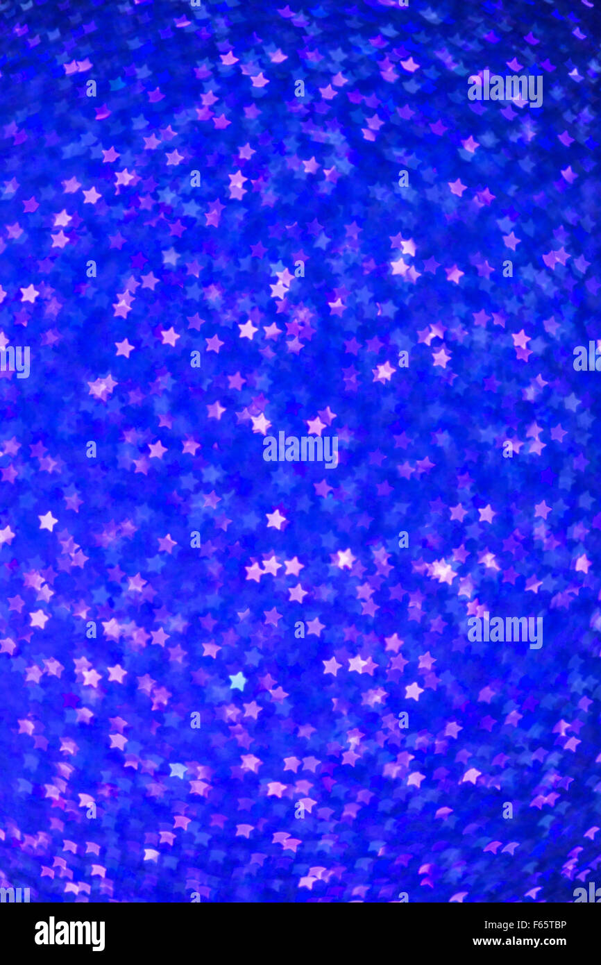 Festive Christmas background with stars. Abstract twinkled bright background with bokeh ...