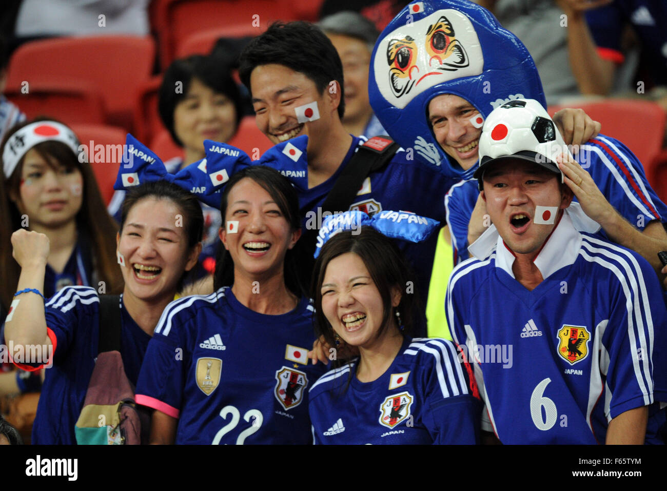 Singapore. 12th Nov, 2015. Japan's football fans pose for photos before ...
