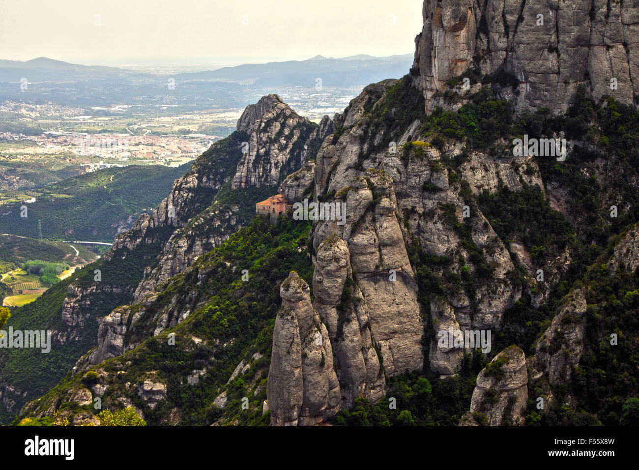 The Santa Cova Chapel perched into the side of Montserrat of Barcelona ...