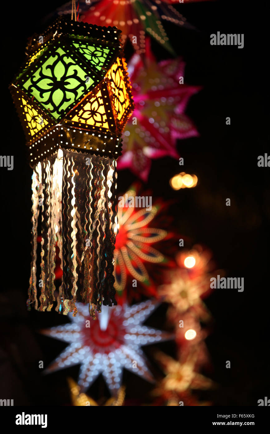 A traditional Diwali lantern on the backdrop of other lanters during ...