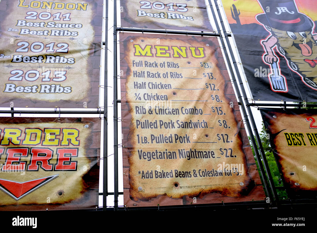 Menu signs above stall at the annual Rib Fest held in the Canadian city ...