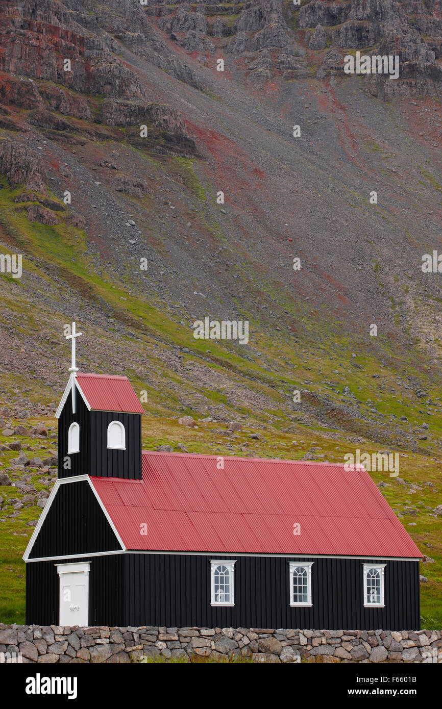 Colored church at the base of a mountain in Iceland Stock Photo - Alamy