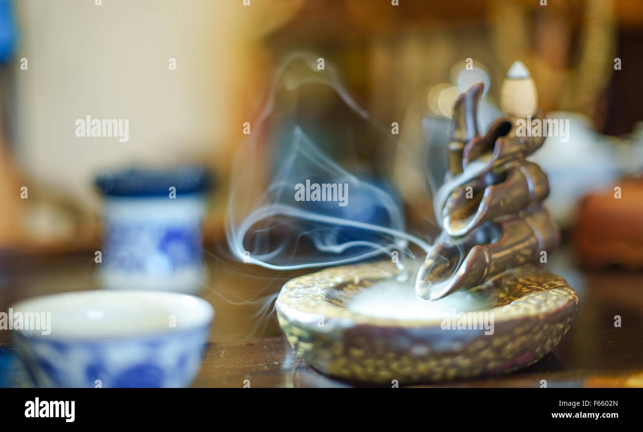 A cup of whole leaf lapsang souchong tea, a rich smoky flavored tea ...