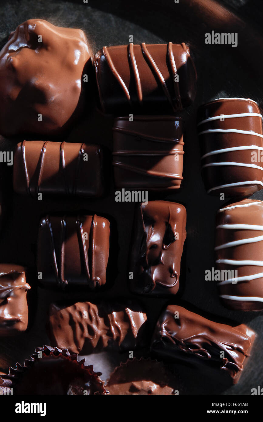 Birds eye view of assorted chocolates in diagonal placement on silver ...