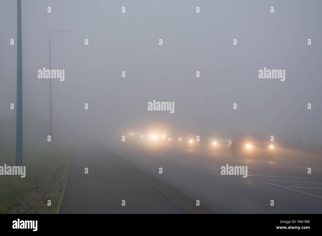 Cars driving slowly in thick mist, Scotland, UK Stock Photo - Alamy