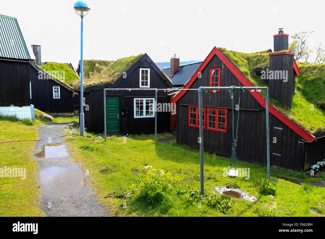 Faroese traditional black tarred timber houses with grass turf roof ...