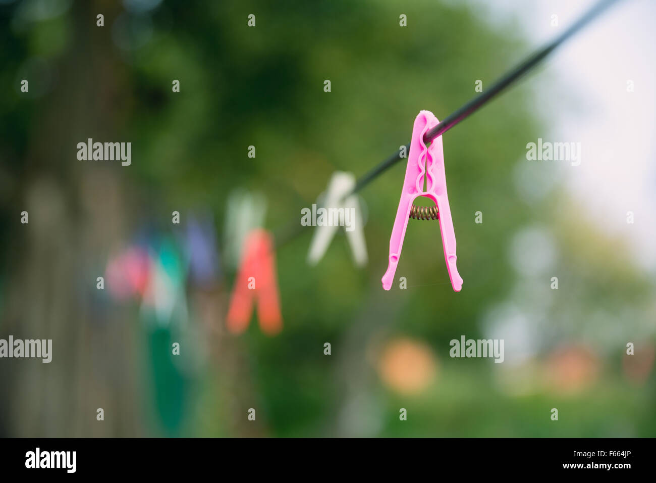 Colorful clothespins on a line Stock Photo - Alamy