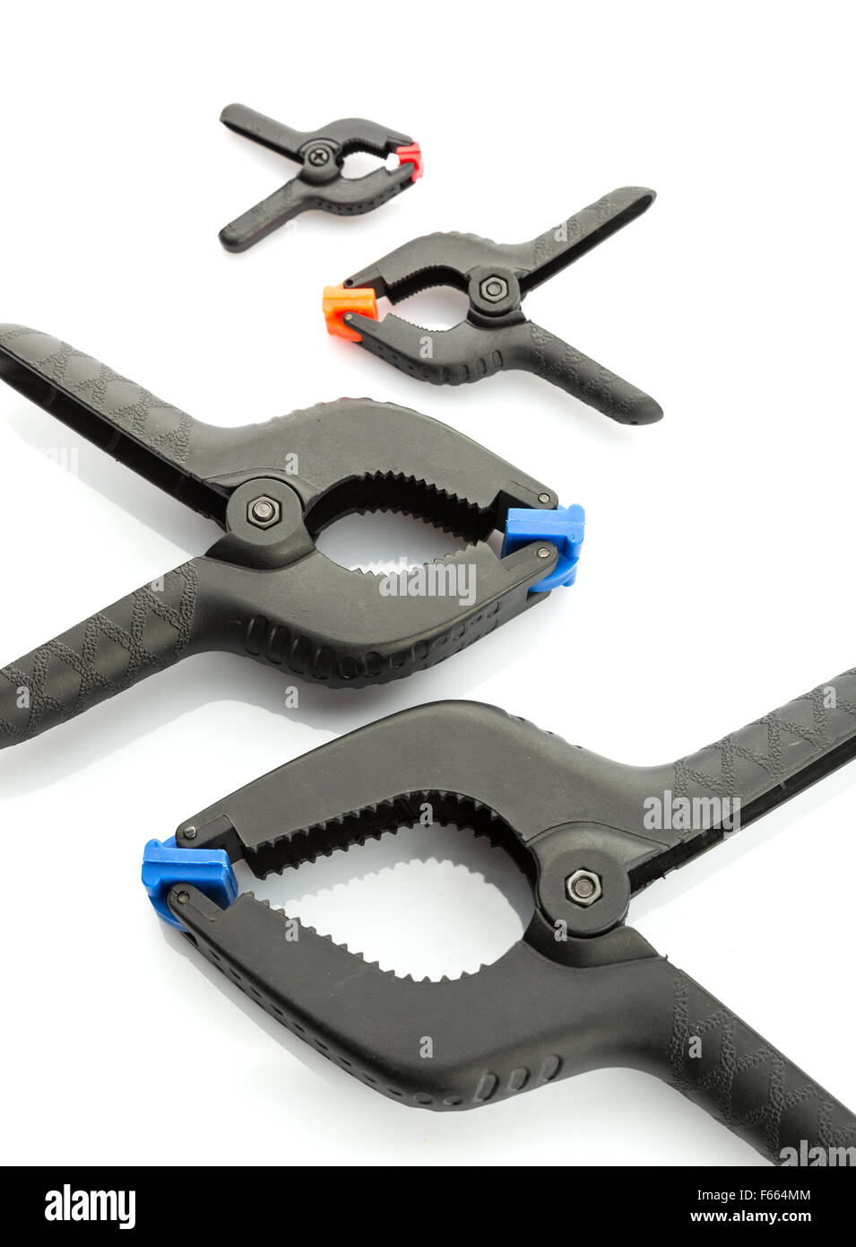 Set of plastic clamps isolated on white Stock Photo - Alamy