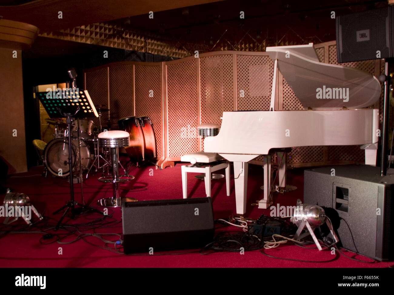 Musical instruments in restaurant stage Stock Photo - Alamy