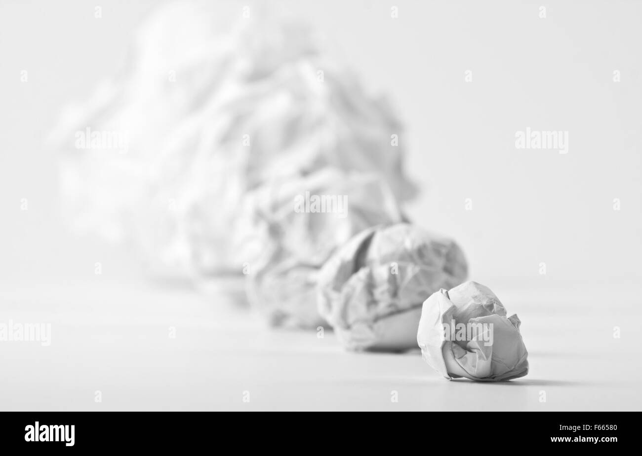 Concept of crumpled paper balls on white Stock Photo - Alamy