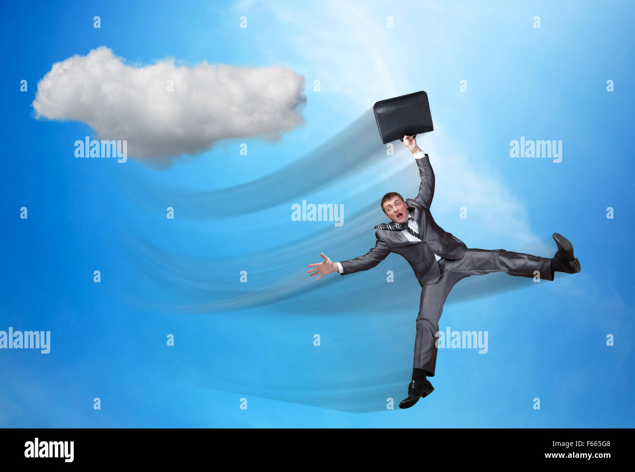 Businessman is falling in the sky Stock Photo - Alamy