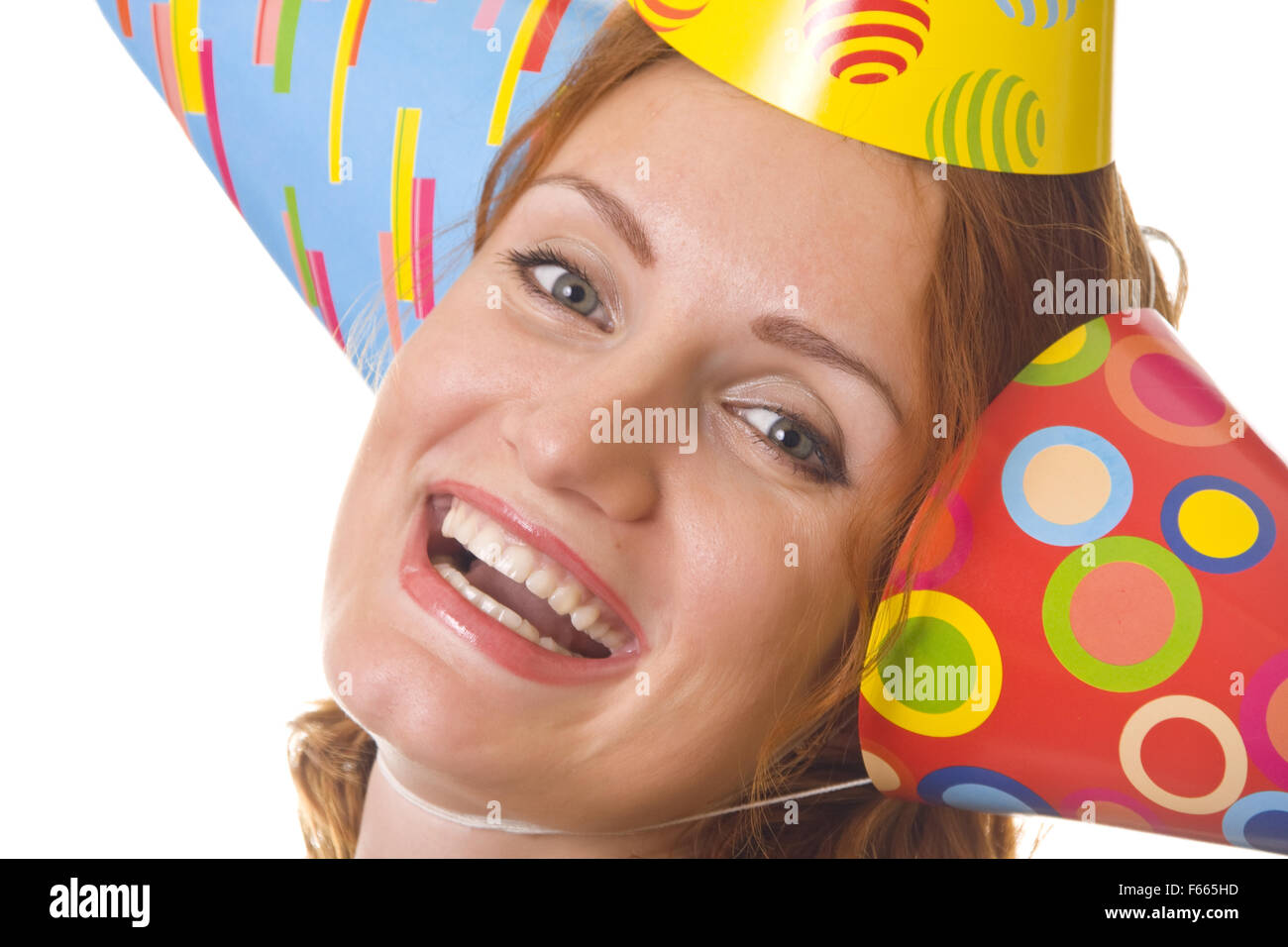 Laughing happy woman in three party hats Stock Photo - Alamy