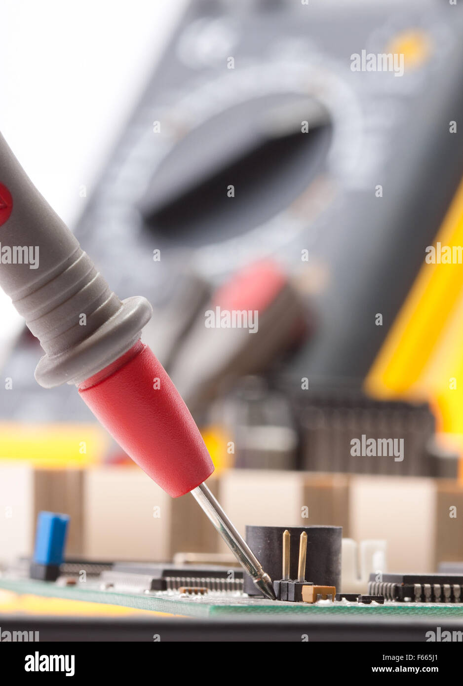 Probe of digital multimeter analyzing electronics circuit Stock Photo ...