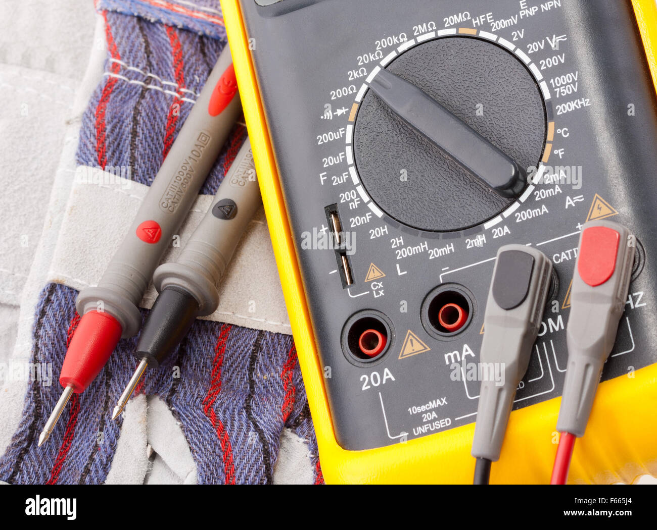 Close-up view of digital multimeter, probes and gloves Stock Photo - Alamy