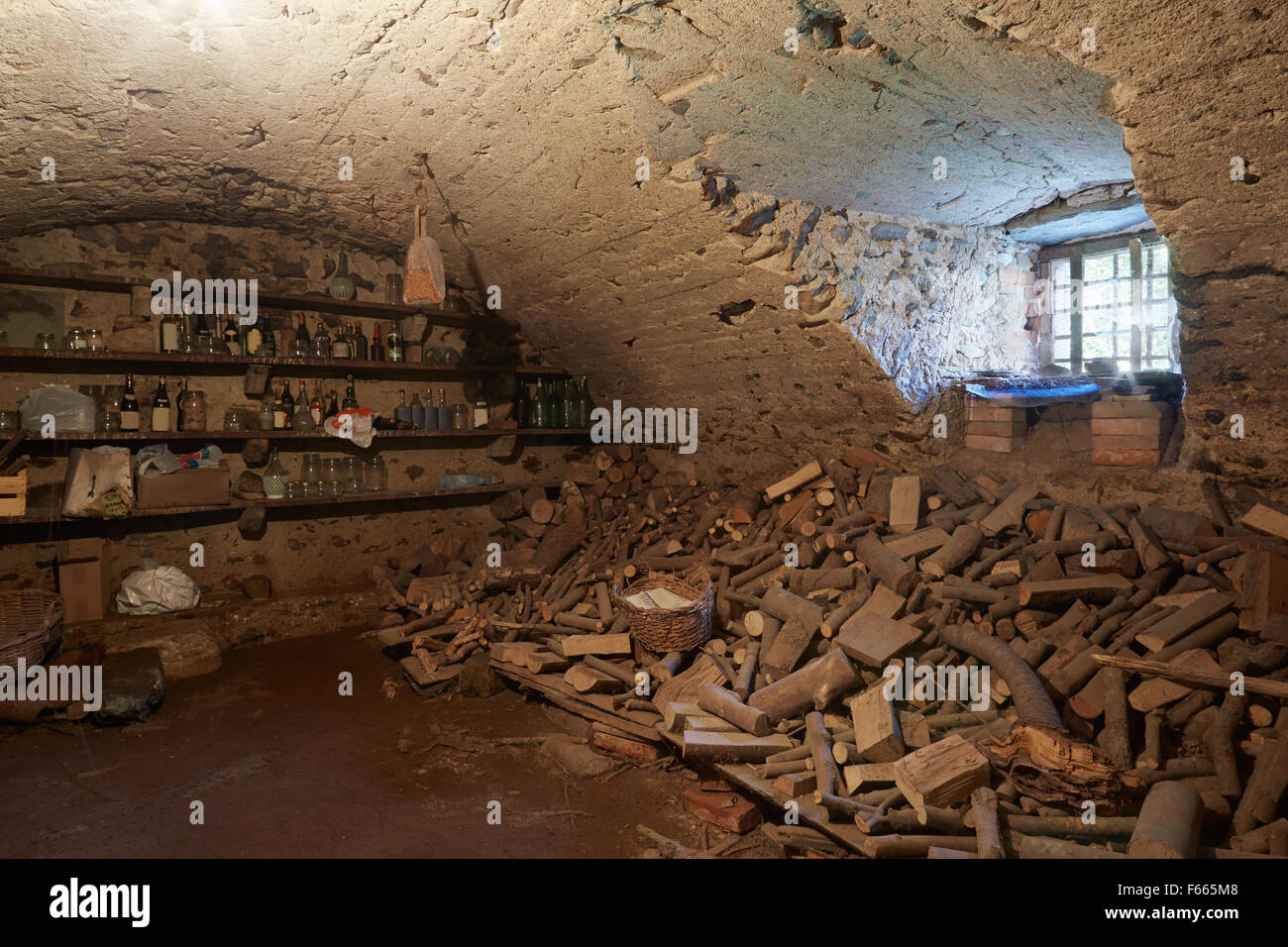 Old, dark basement with wood pile in ancient house Stock Photo - Alamy