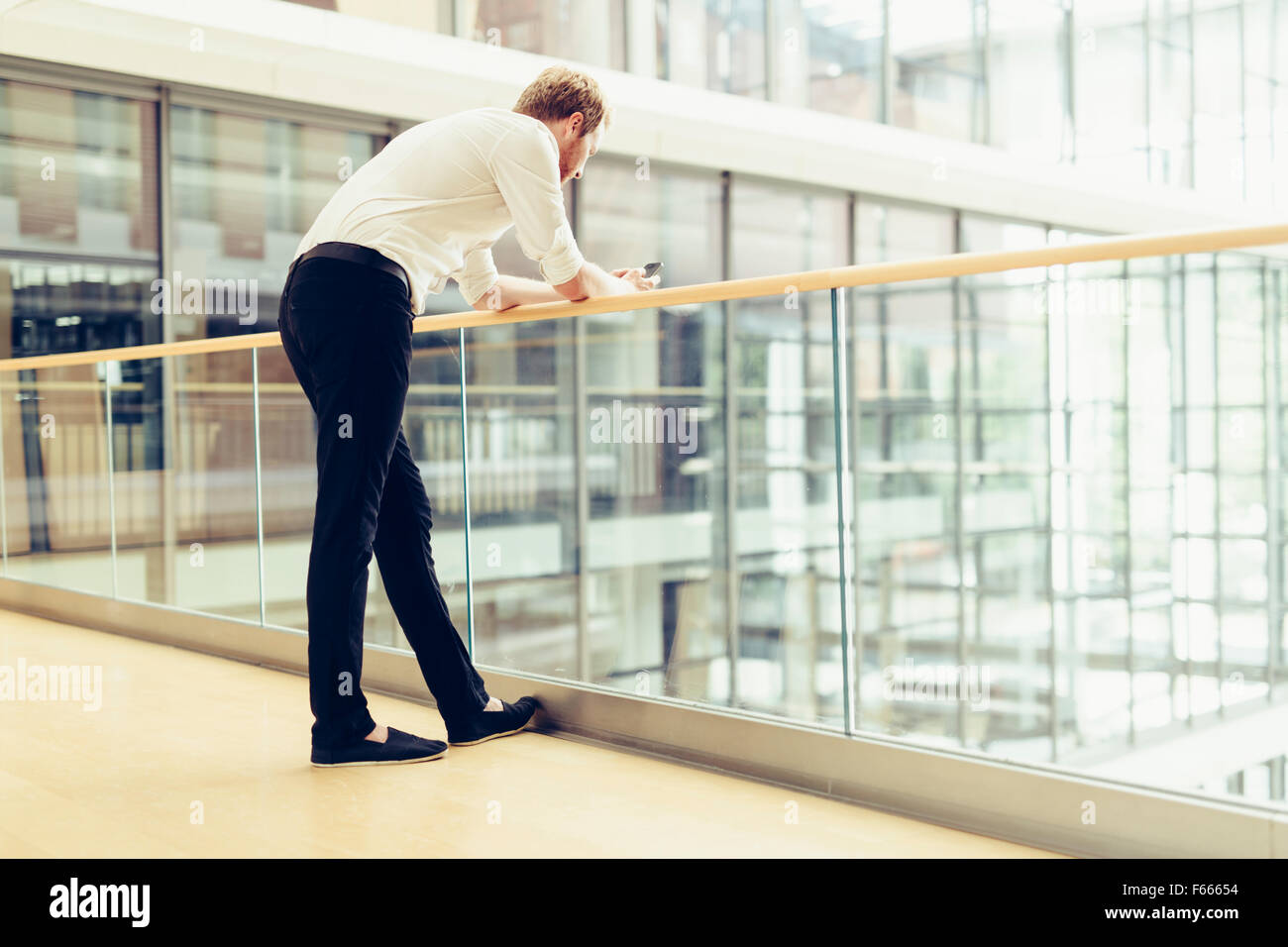 Man Leaning On Balcony Railing High Resolution Stock Photography and ...