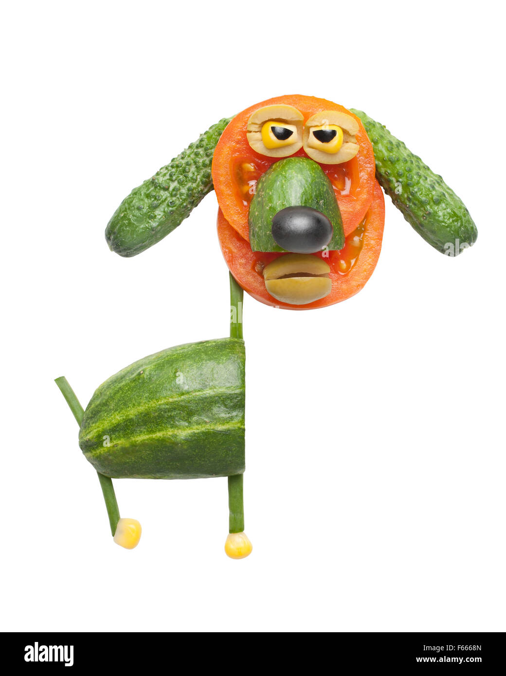 Funny dog made of cucumber and tomato Stock Photo - Alamy