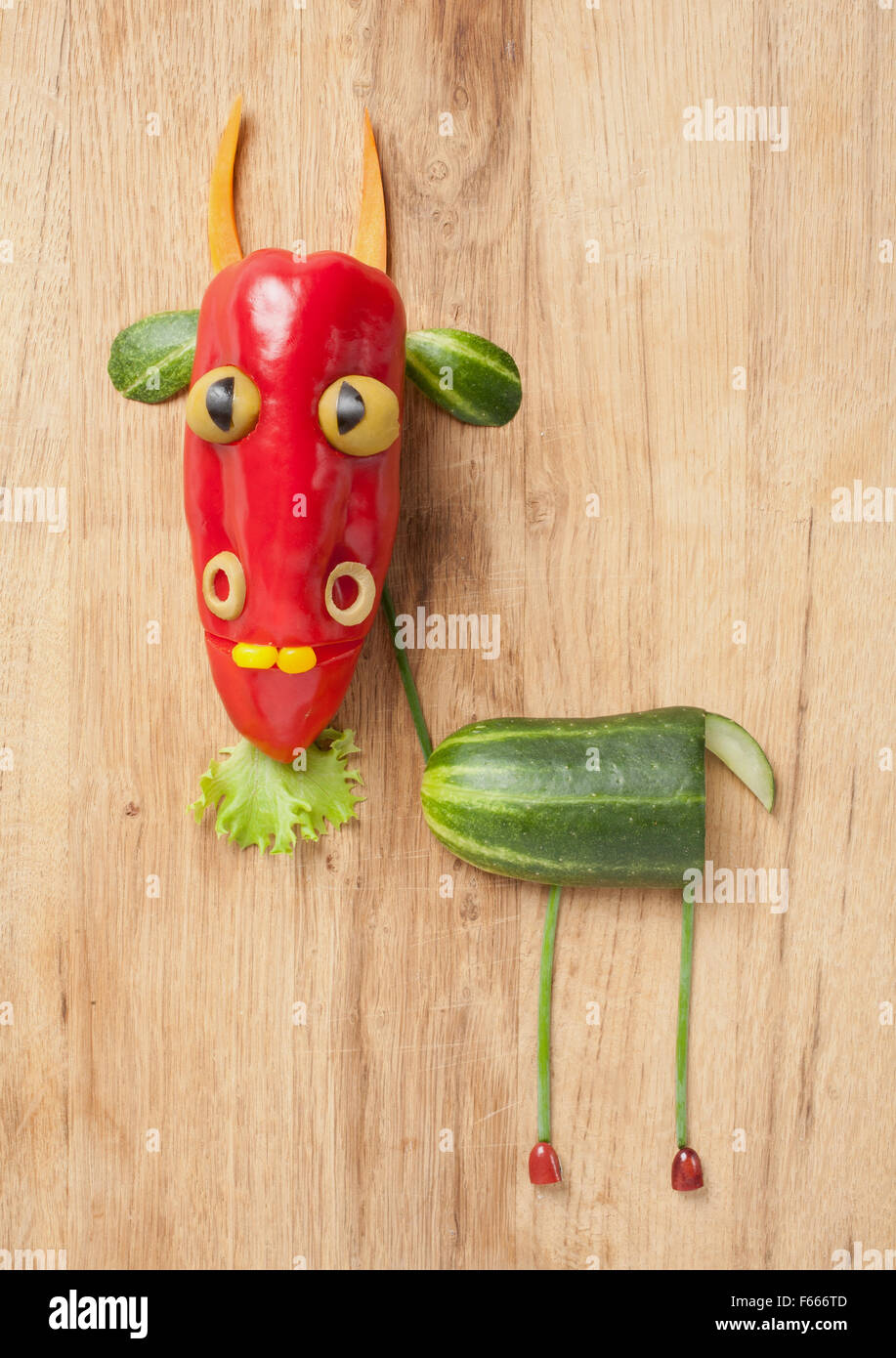 Funny goat made of vegetables on wooden background Stock Photo - Alamy