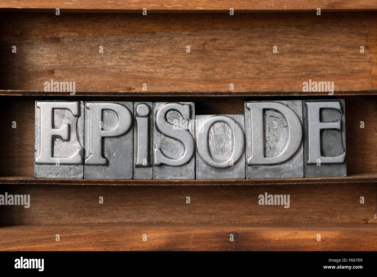 episode word made from metallic letterpress type on wooden tray Stock ...