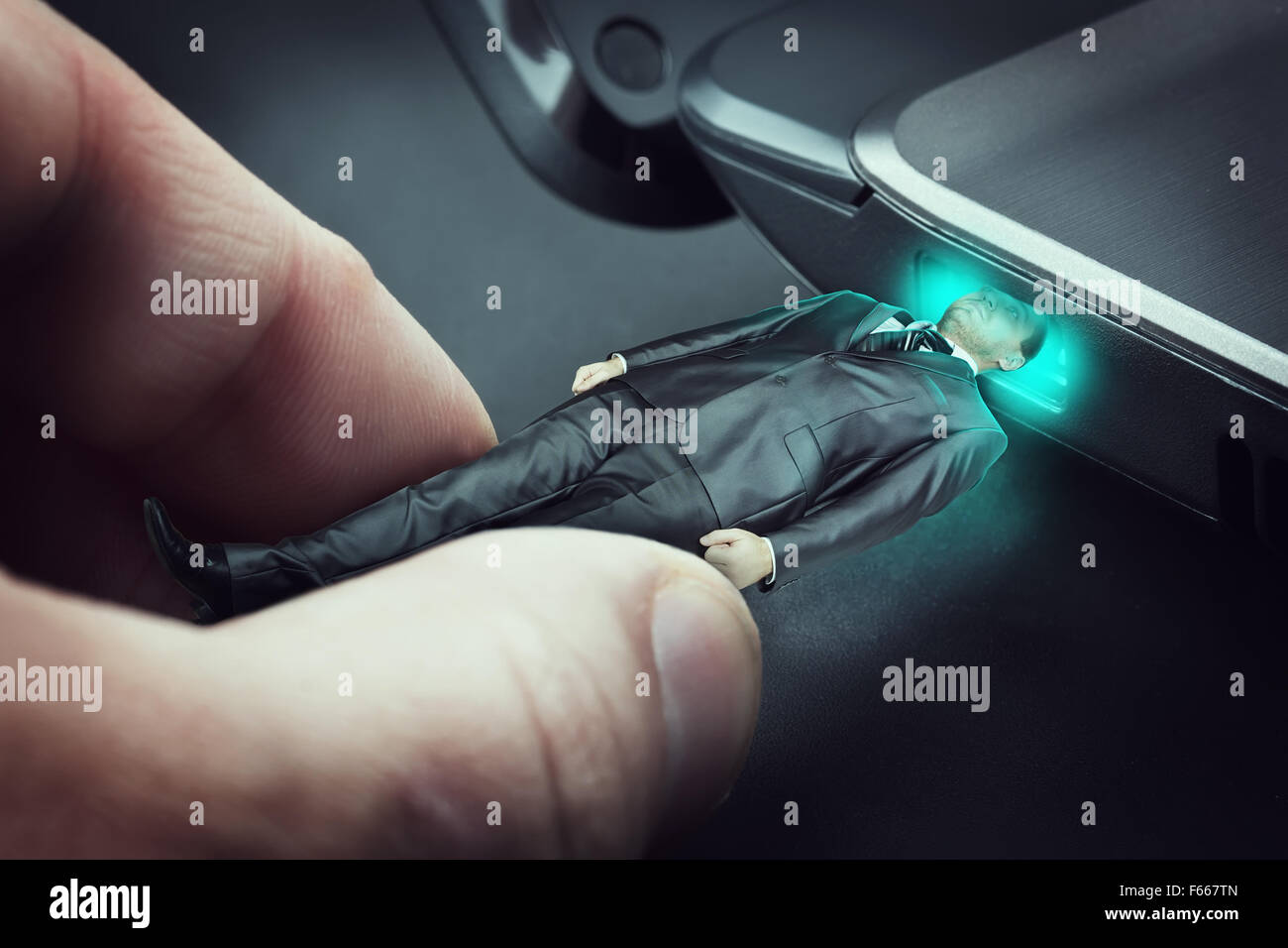 Man is plugged into the laptop as a flash drive Stock Photo - Alamy