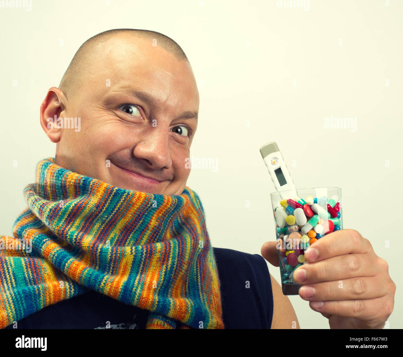 Happy man drinking cocktail of colorful pills Stock Photo - Alamy