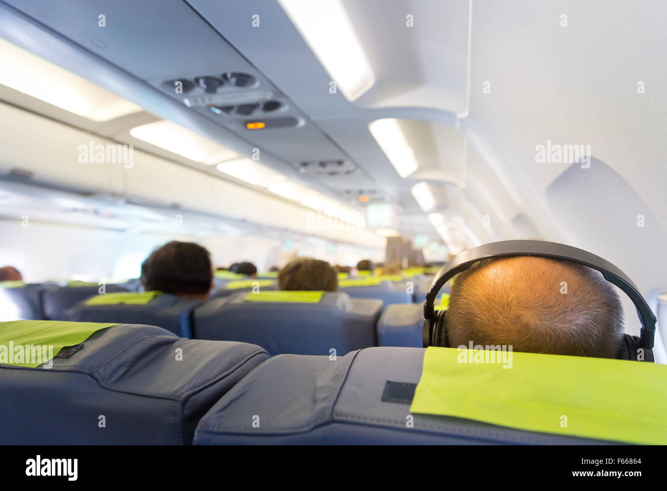 Male head in headphones in the plane salon close up Stock Photo - Alamy