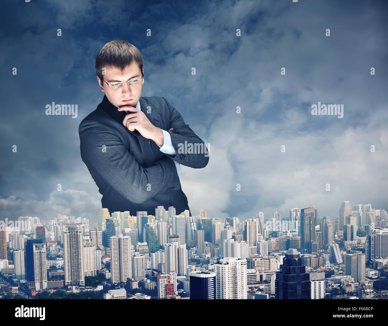 Young businessman staying behind the city Stock Photo - Alamy