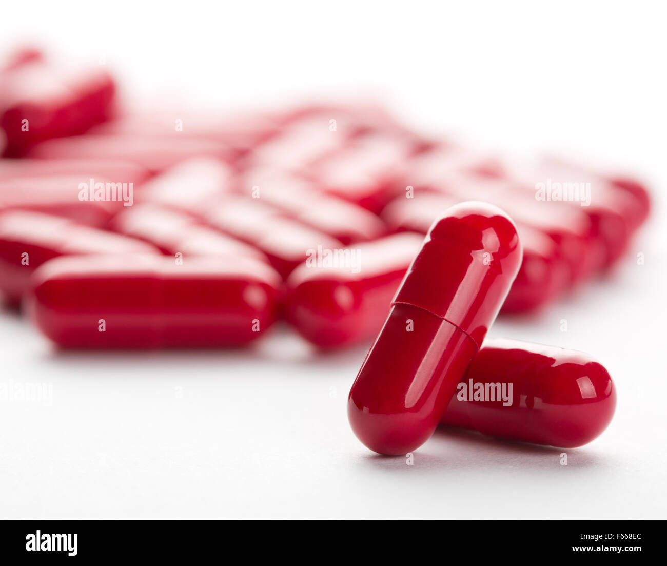 Closeup of red medicine capsules Stock Photo - Alamy