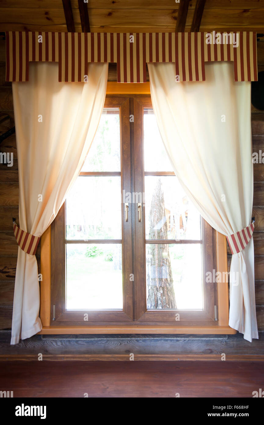 Sunlight window with curtains in wooden chalet Stock Photo - Alamy