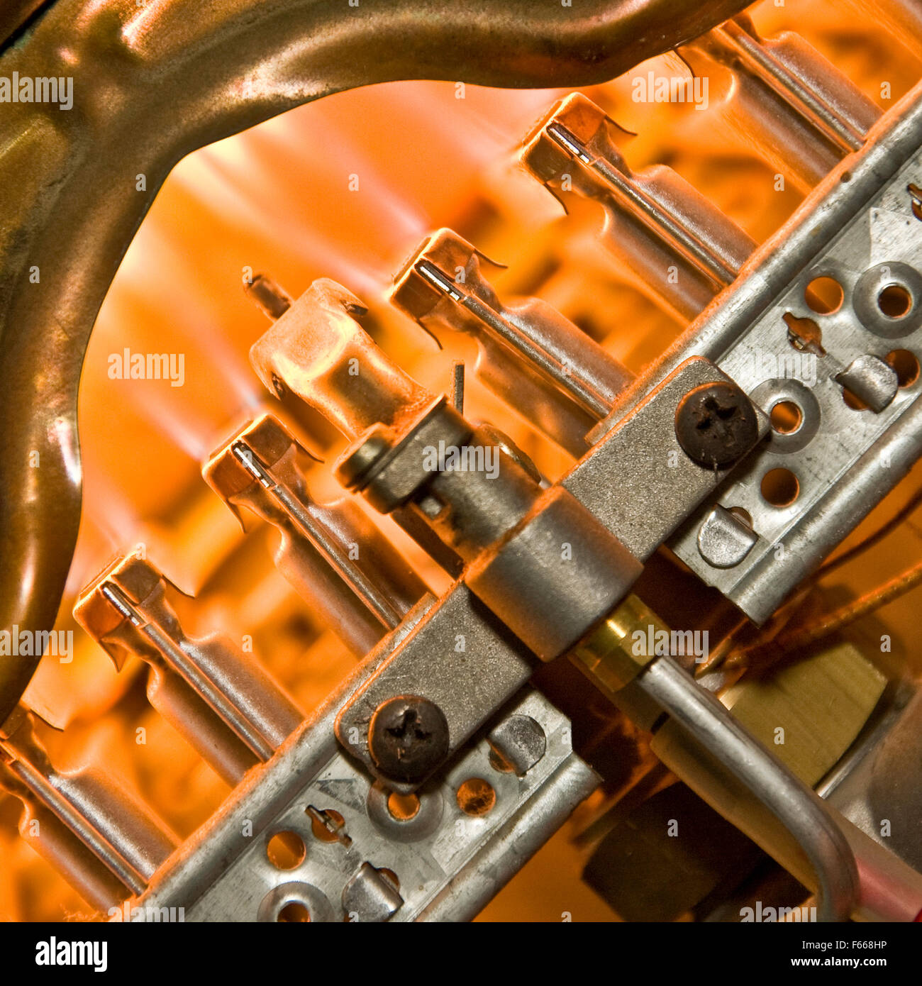 Burner of gas boiler on work. Inside the boiler Stock Photo - Alamy