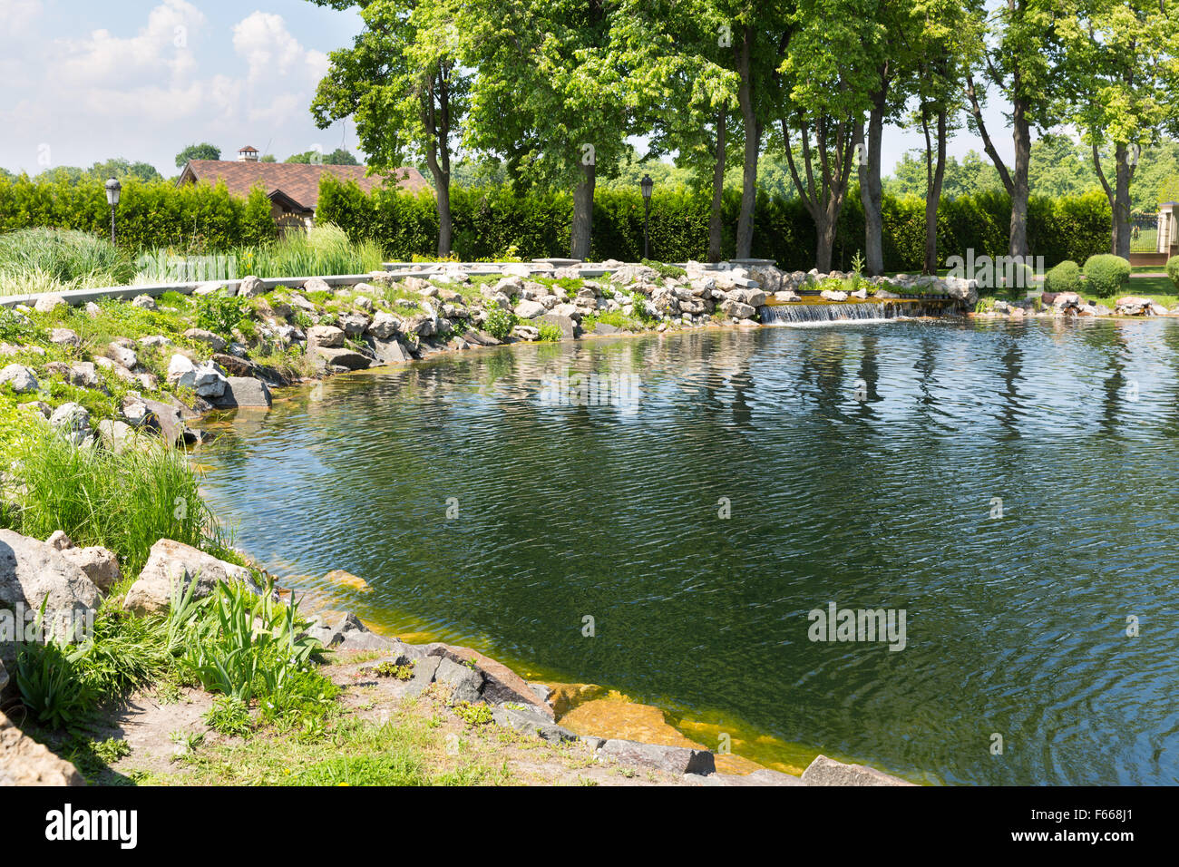 Beautiful pond in spring park Stock Photo - Alamy