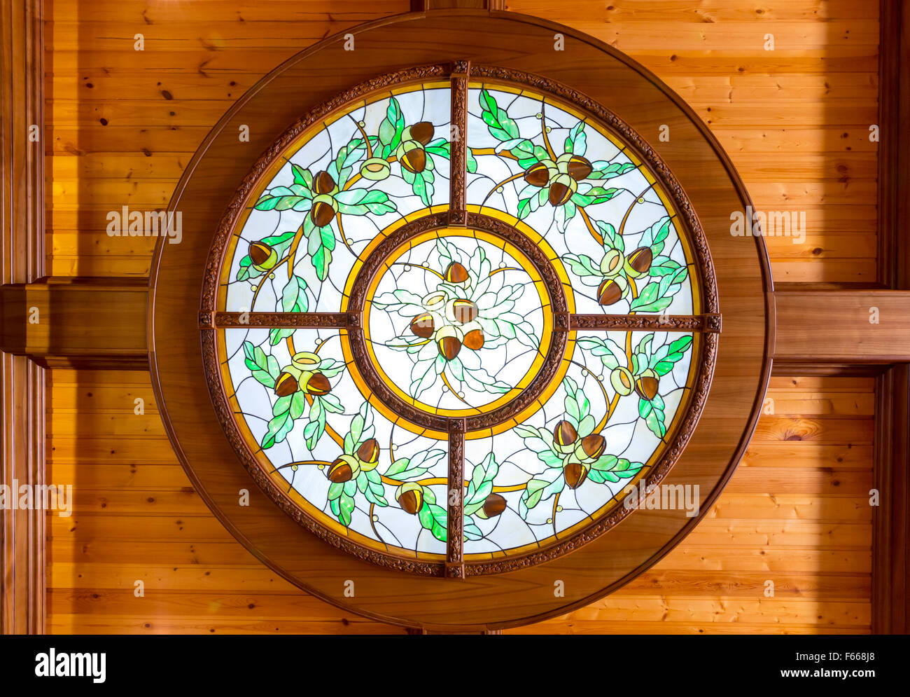 Round beautiful stained window with acorn pattern Stock Photo - Alamy