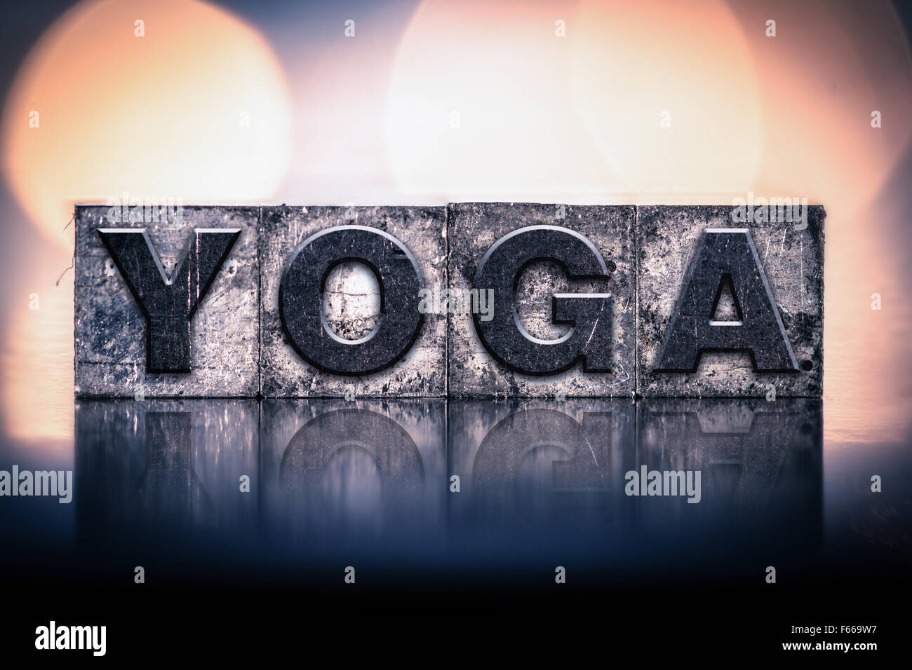The word "YOGA" written in vintage ink stained letterpress type Stock ...