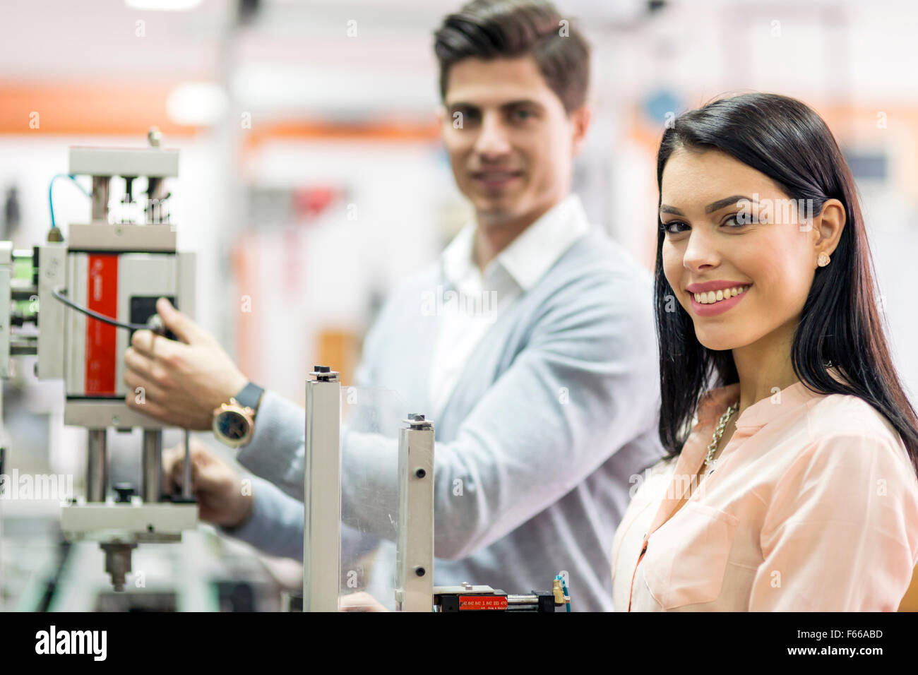 Two young students working on a science project together in lab Stock ...