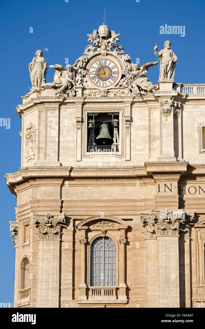 The clock with the church bell on the top of the Saint Peter Basilica in Vatican Stock Photo - Alamy