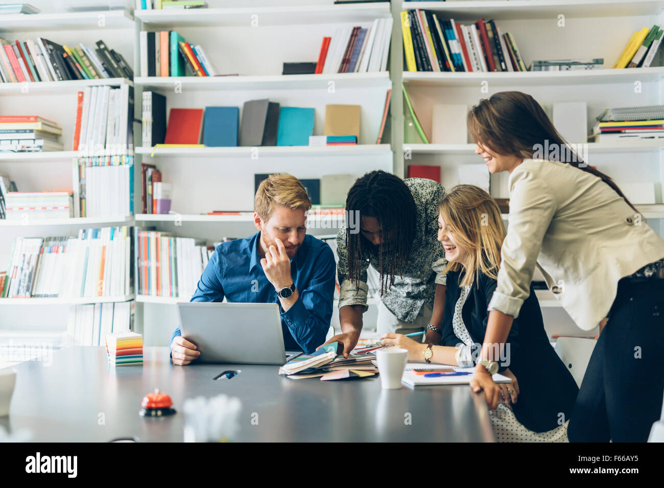 Brainstorming event between colleagues at work in office Stock Photo ...